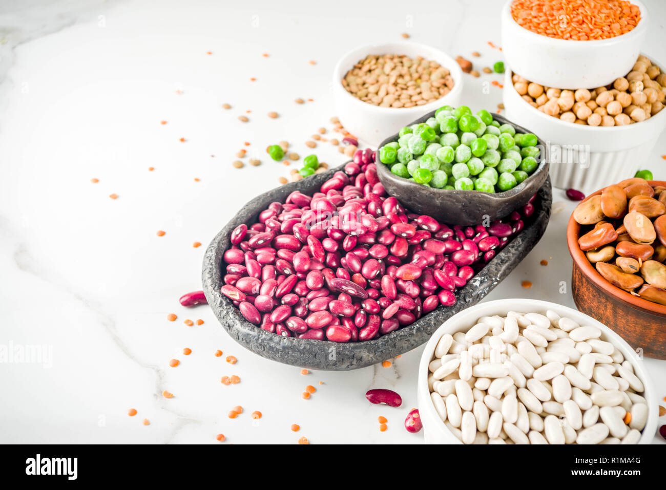 Various assortment of legumes - beans, soy beans, chickpeas, lentils ...