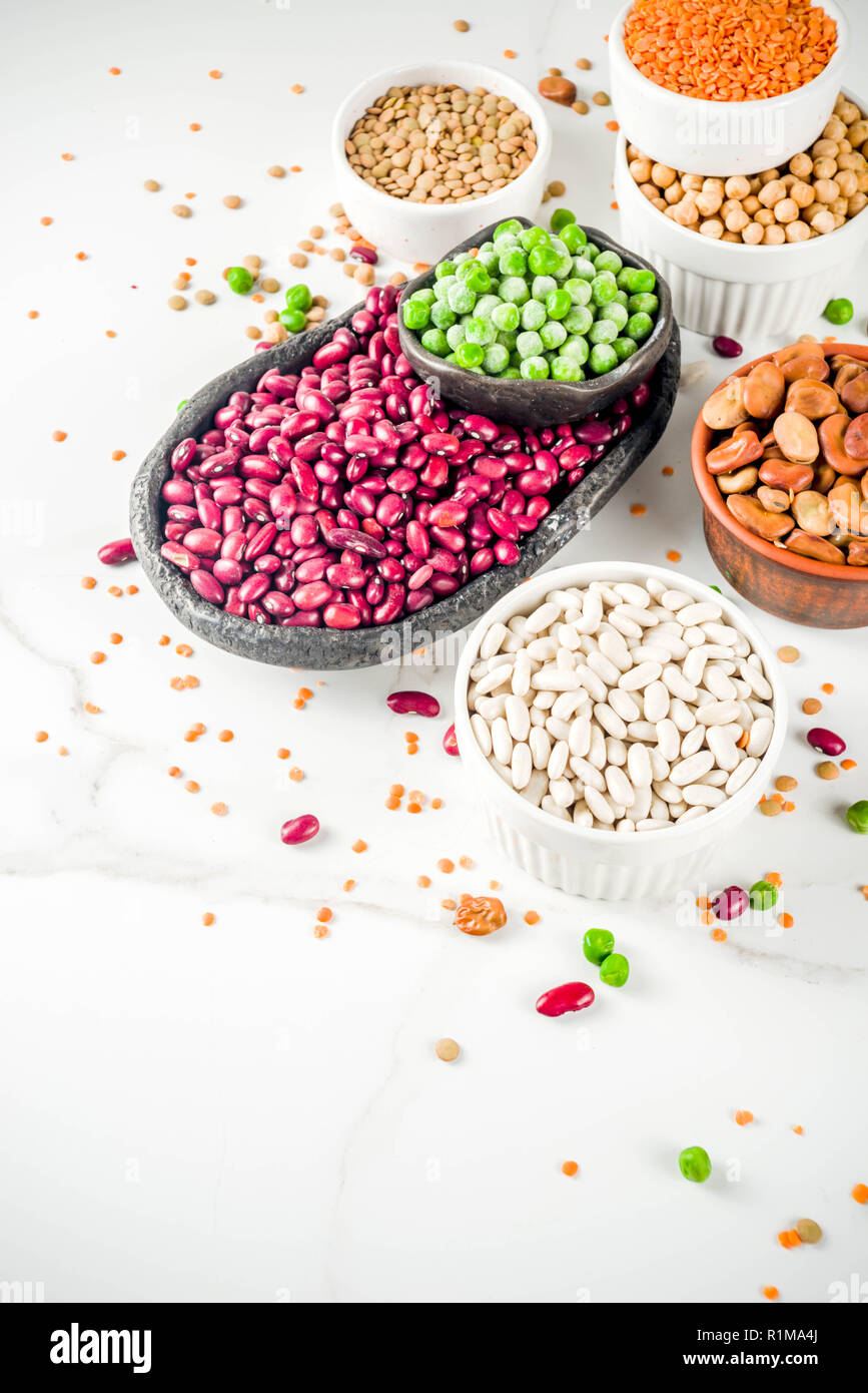 Various assortment of legumes - beans, soy beans, chickpeas, lentils ...