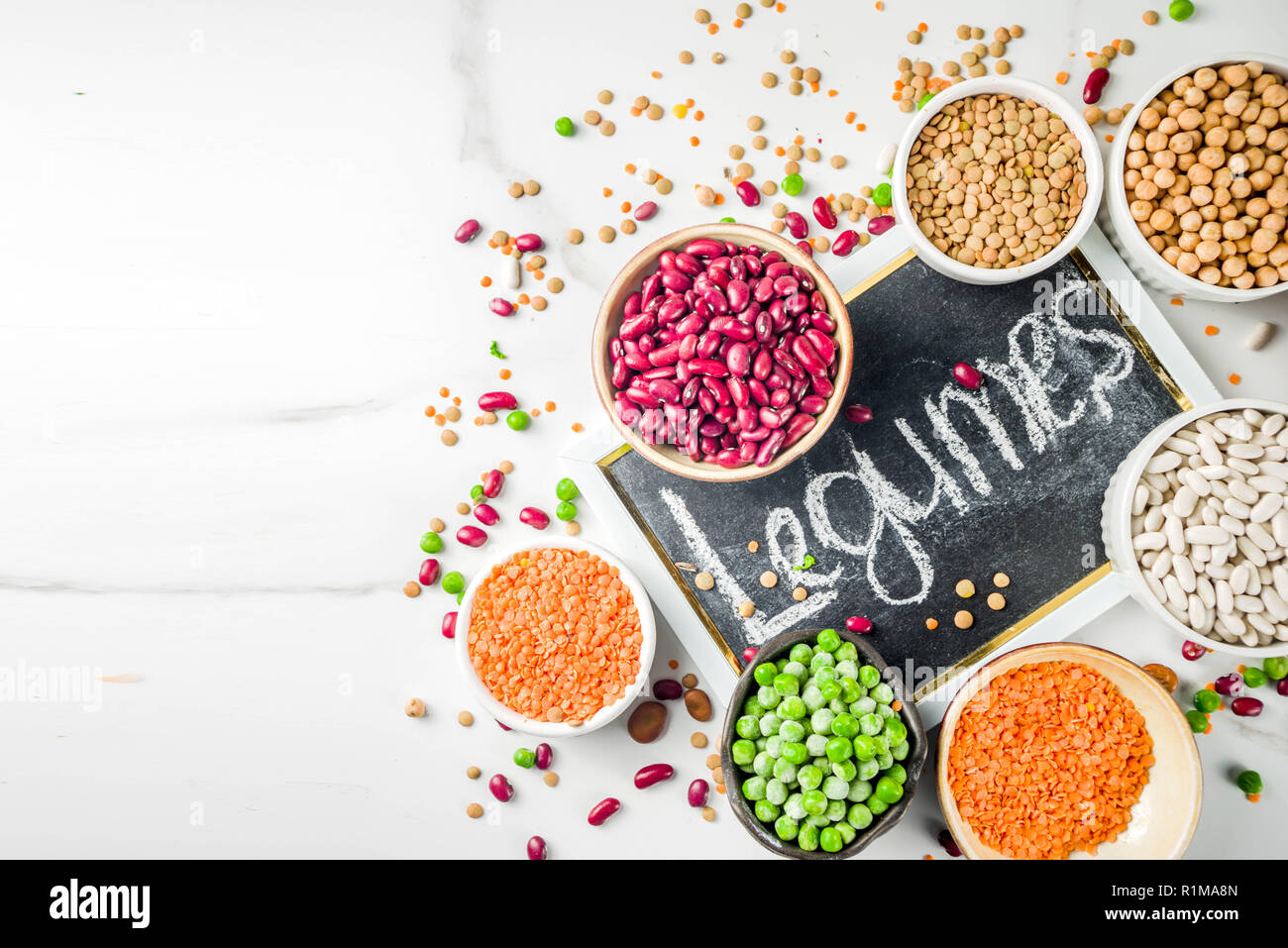 Various assortment of legumes - beans, soy beans, chickpeas, lentils ...