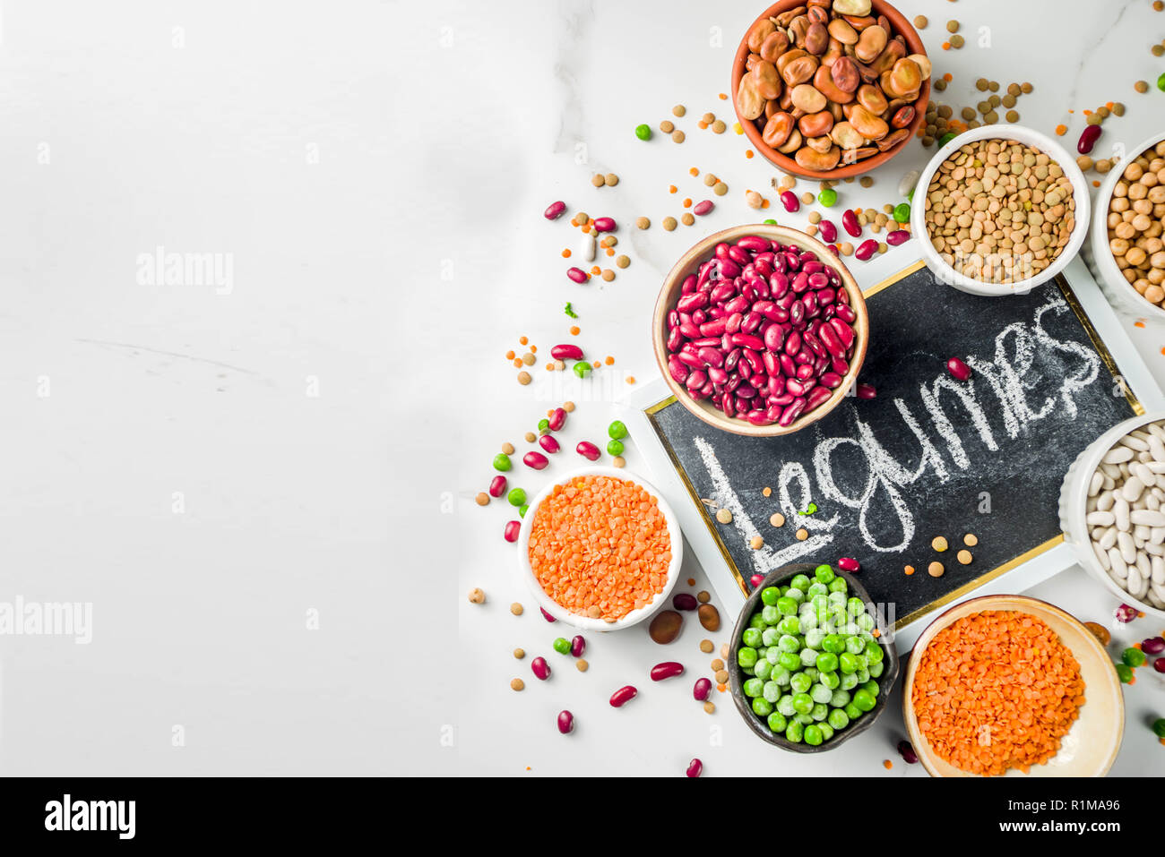 Various assortment of legumes - beans, soy beans, chickpeas, lentils ...