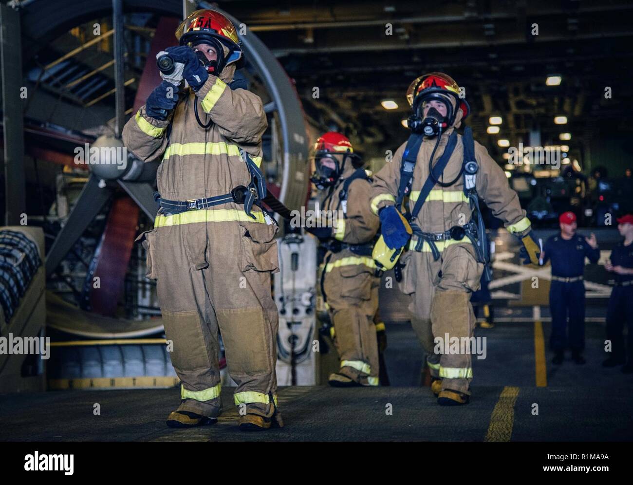 EAST CHINA SEA (Oct. 23, 2018) - Sailors combat a simulated fire during ...
