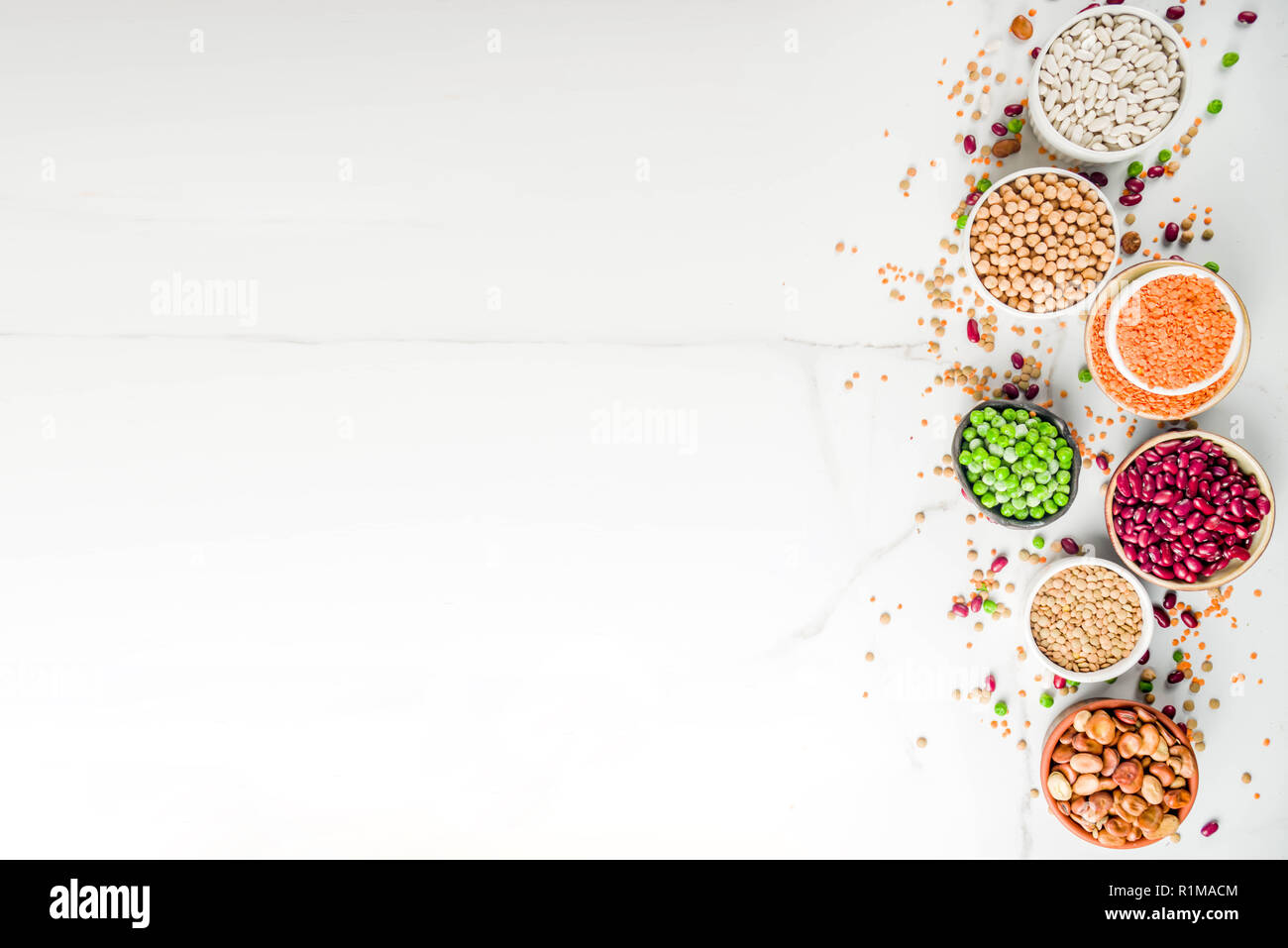 Various assortment of legumes - beans, soy beans, chickpeas, lentils ...