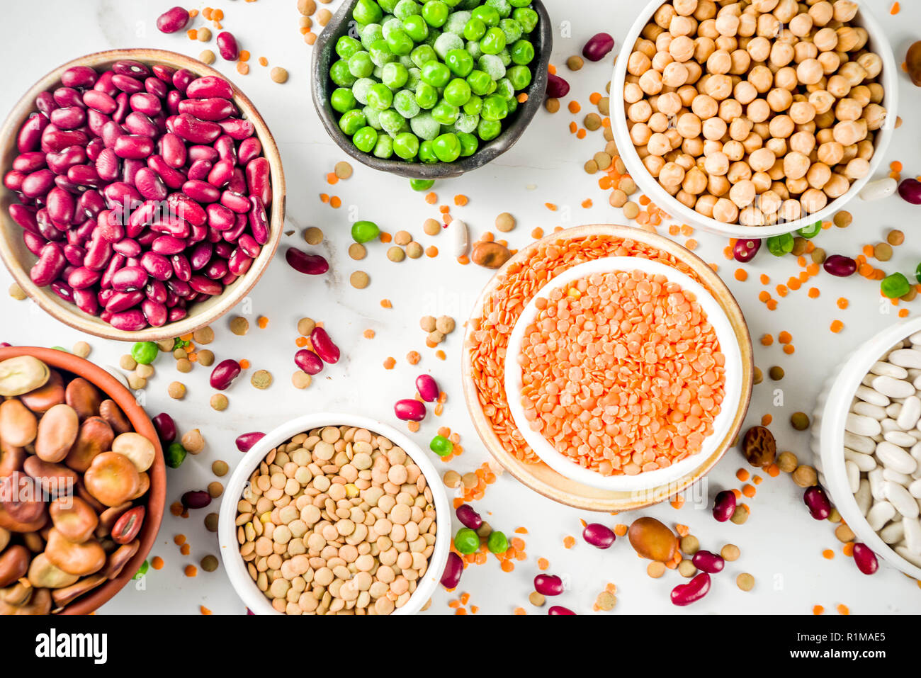 Various assortment of legumes - beans, soy beans, chickpeas, lentils ...
