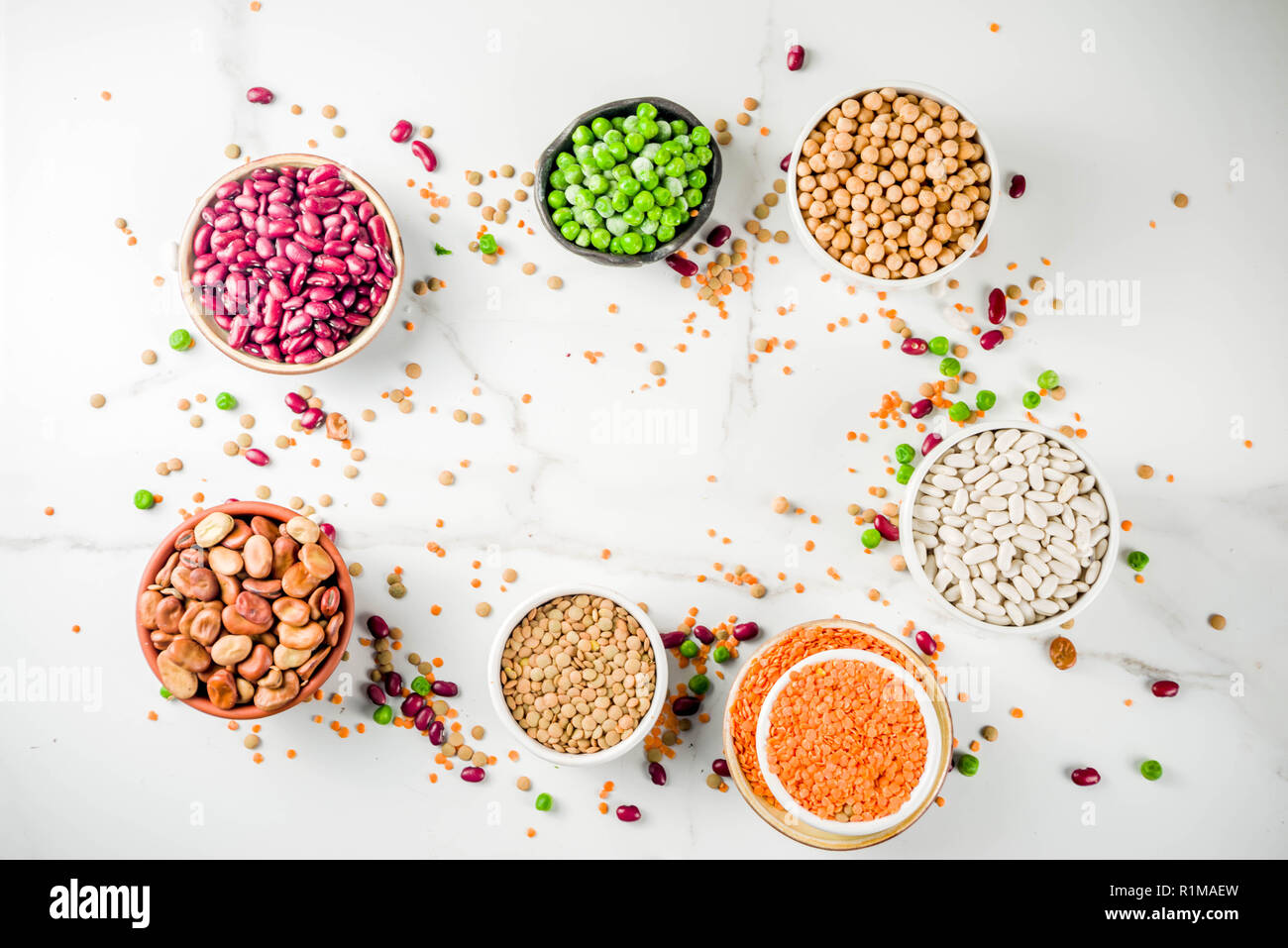 Various assortment of legumes - beans, soy beans, chickpeas, lentils ...