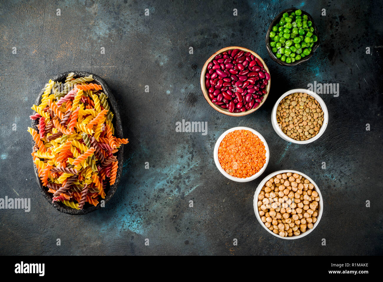 Trend healthy food, vegan diet concept. Multi colored legume pasta with ...