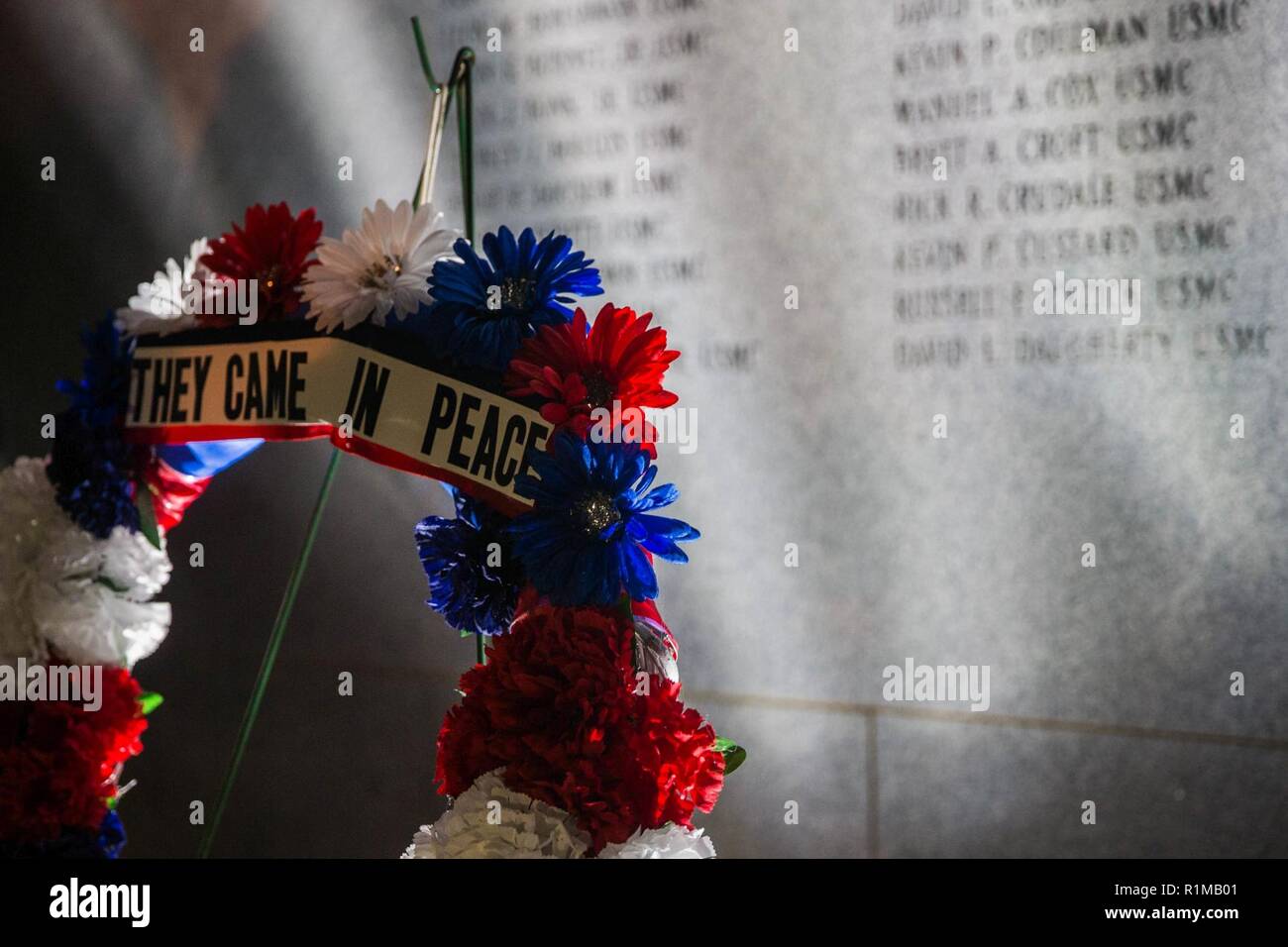 Service members, veterans and families attend a candlelight vigil ...