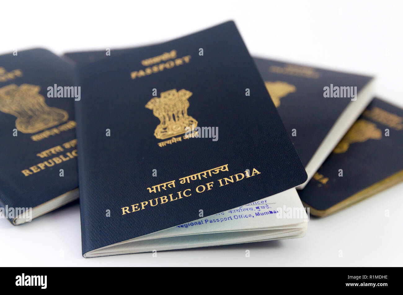 Multiple Indian Passports with white background Stock Photo - Alamy