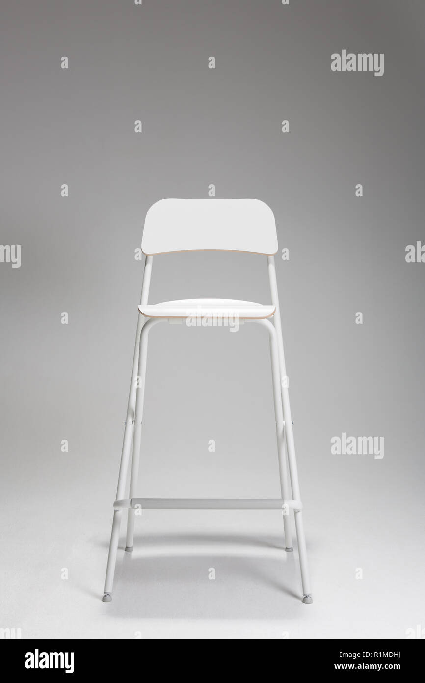 An Empty white chair in a studio Stock Photo - Alamy