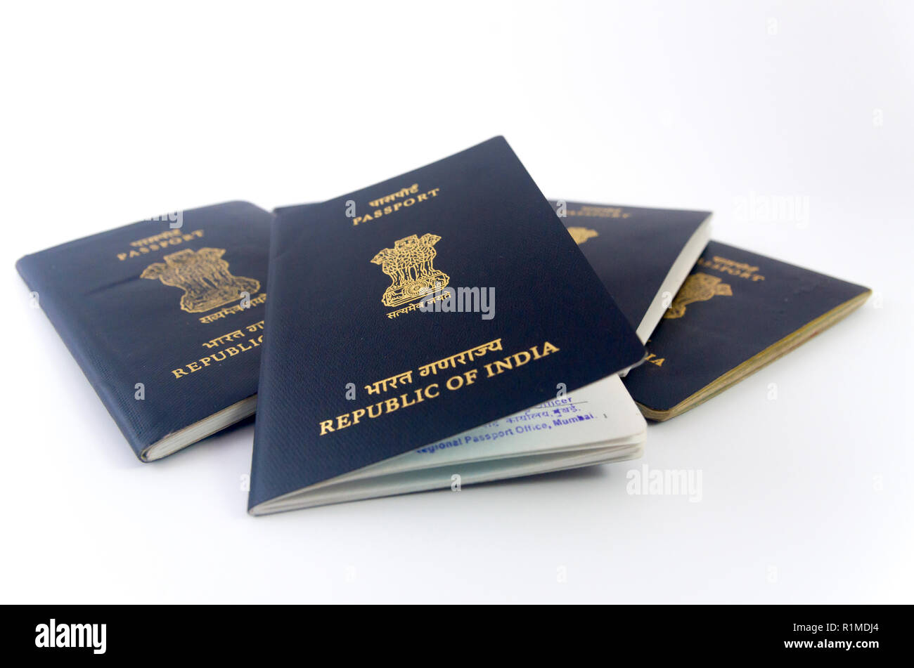 Multiple Indian Passports with white background Stock Photo - Alamy