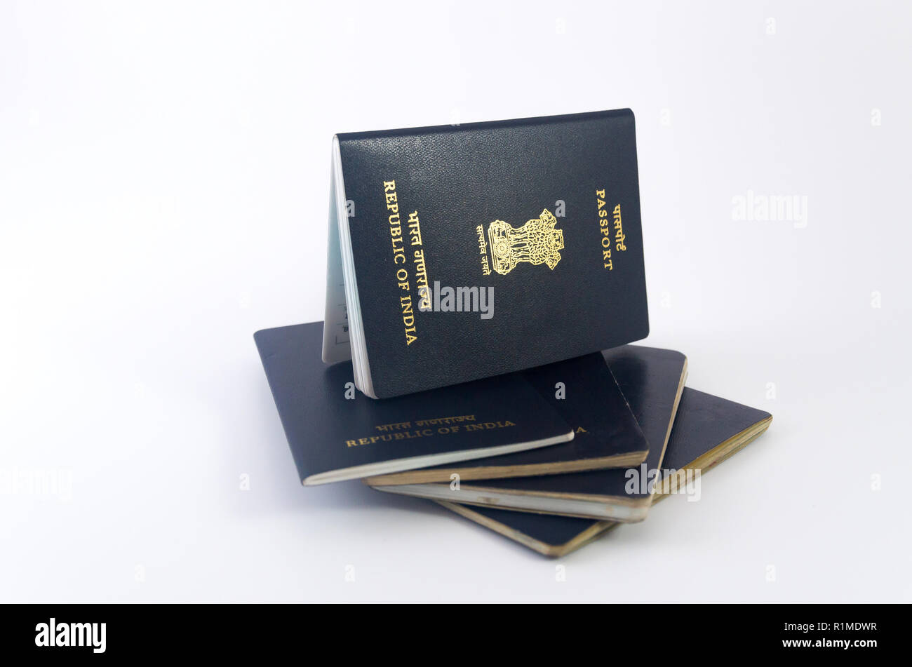 Multiple Indian Passports with white background Stock Photo - Alamy