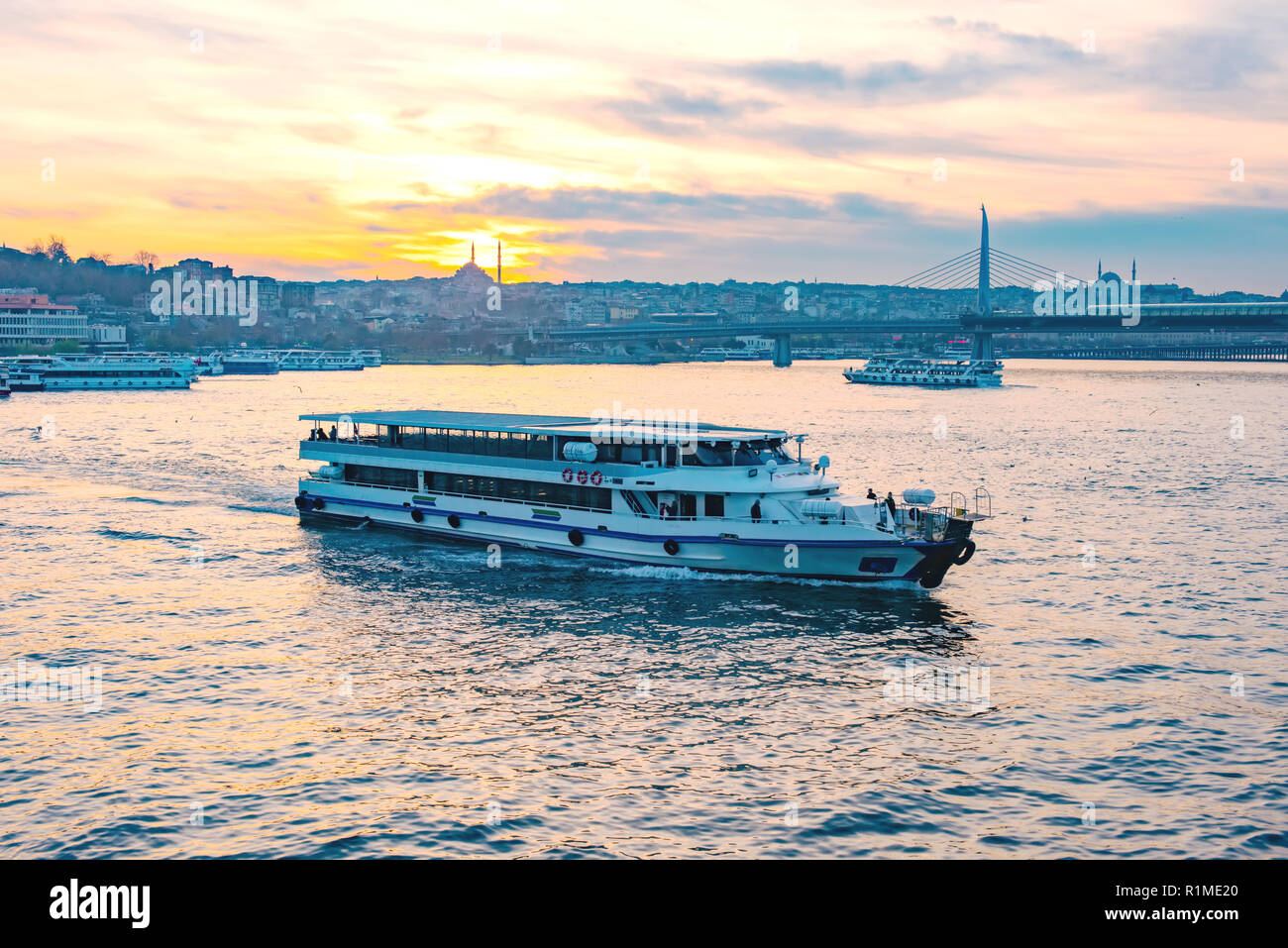Tourist boat in Golden Horn Istanbul at sunset, Turkey Stock Photo - Alamy
