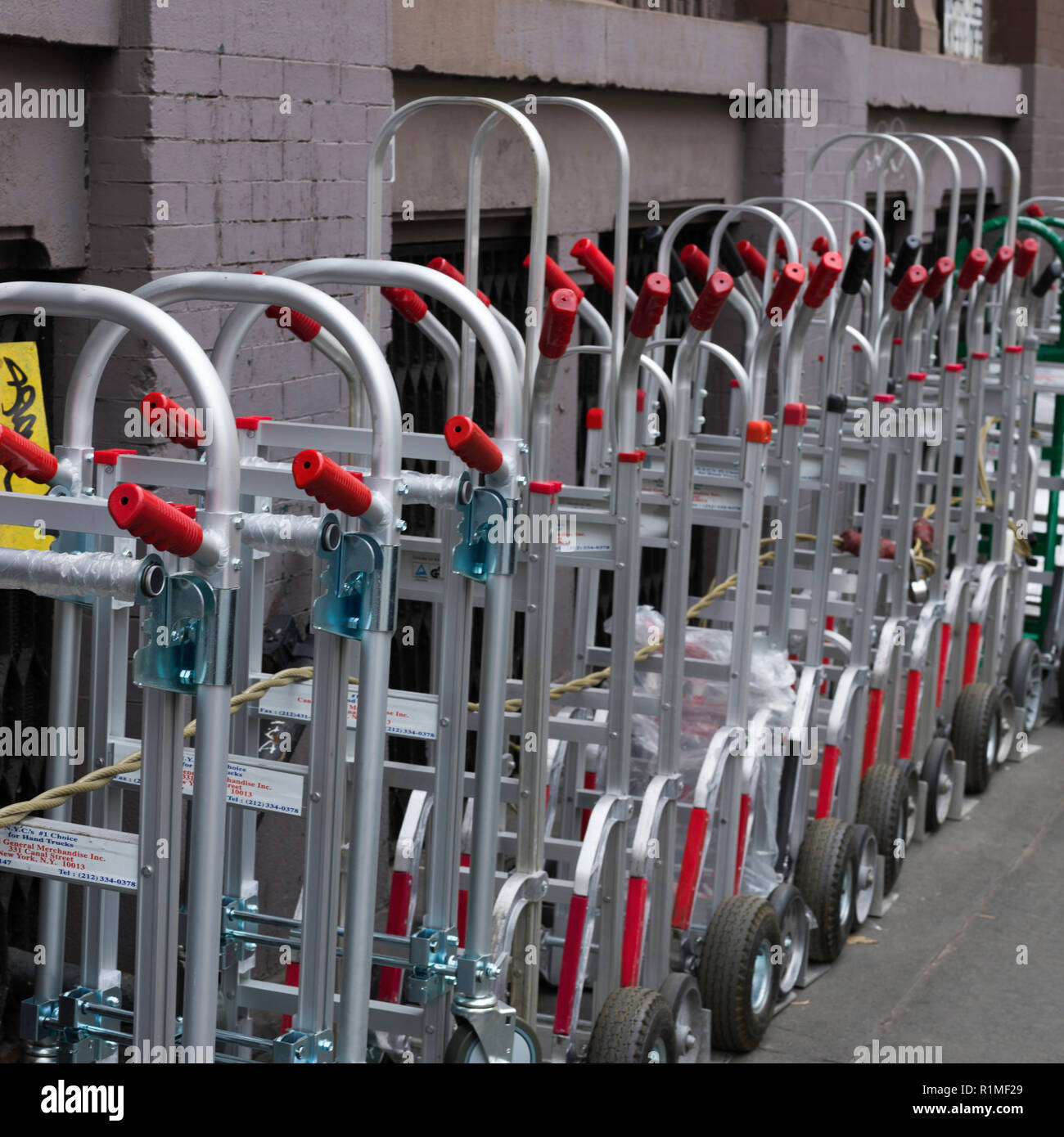 Row of dolly carts on sidewalk, New York City, New York State, USA ...