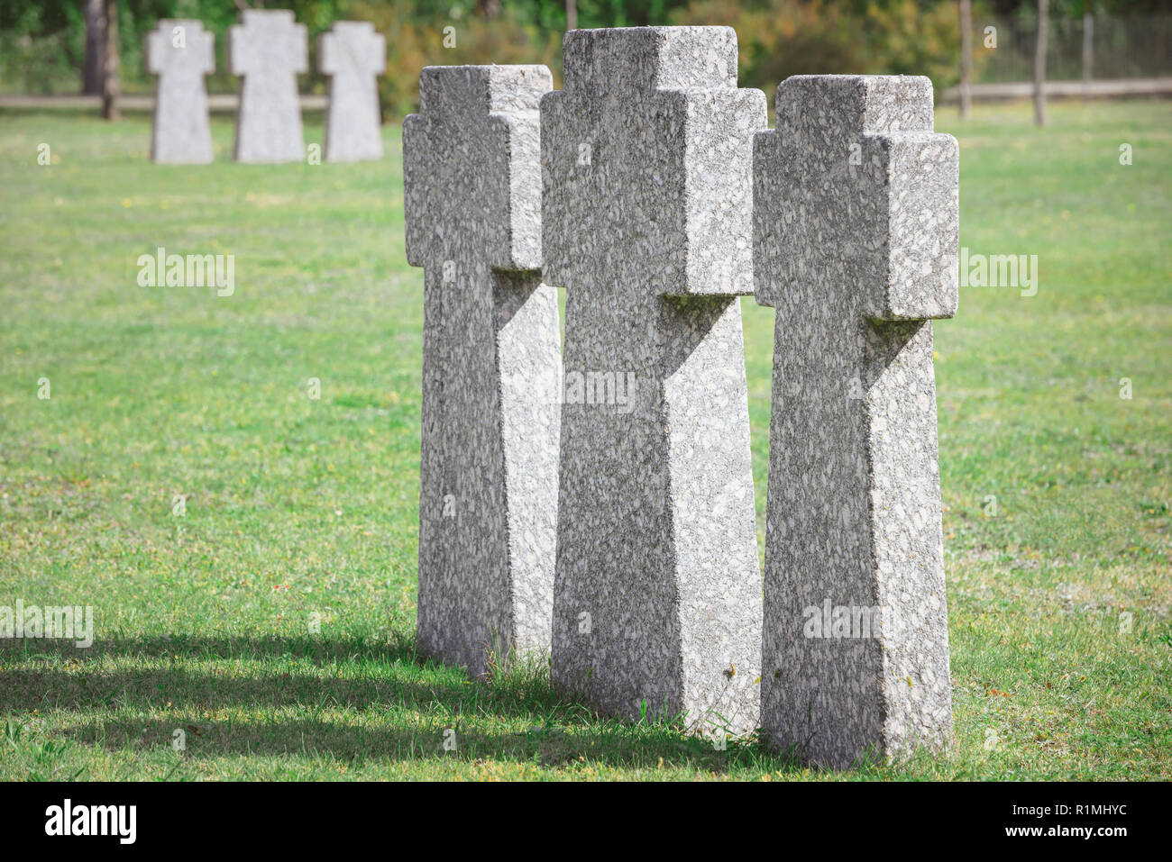 identical old memorial headstones placed in row at graveyard Stock ...