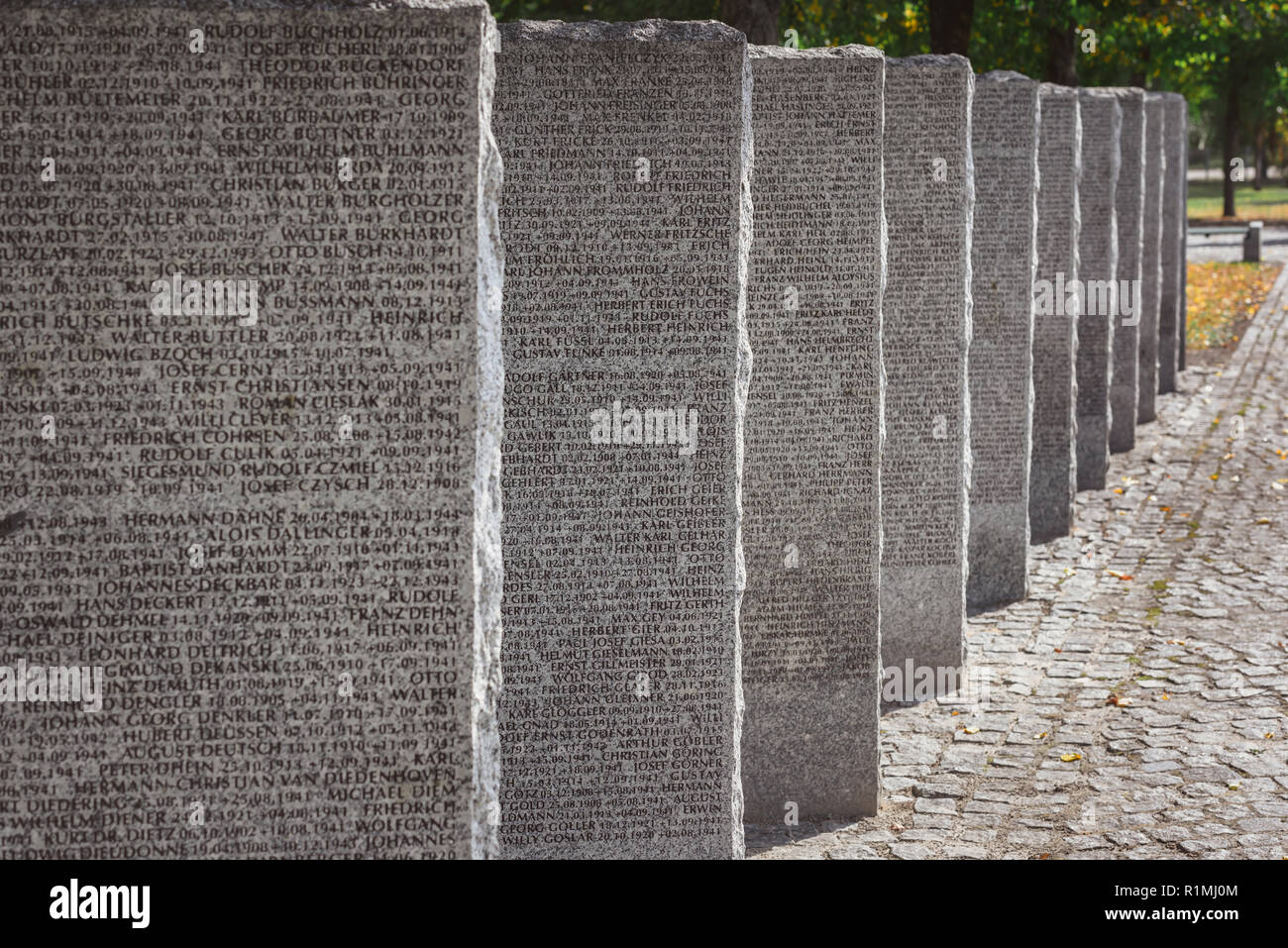 identical stone tombs with lettering placed in row at graveyard Stock ...