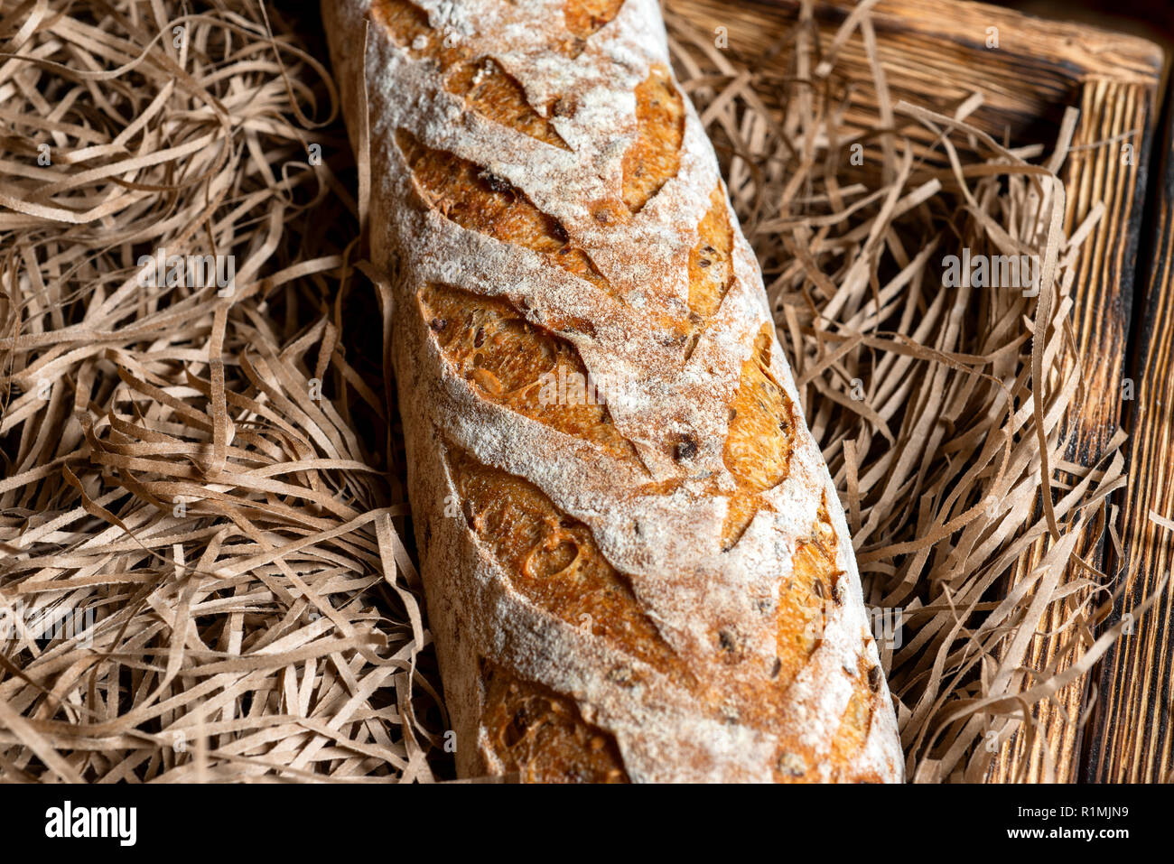 Fresh Bread on brown craft paper on a shop window. Texture and ...