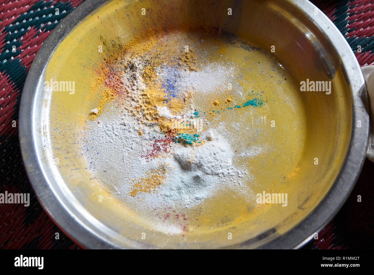 Bowl with colored sand for creating a mandala of colored sand in ...