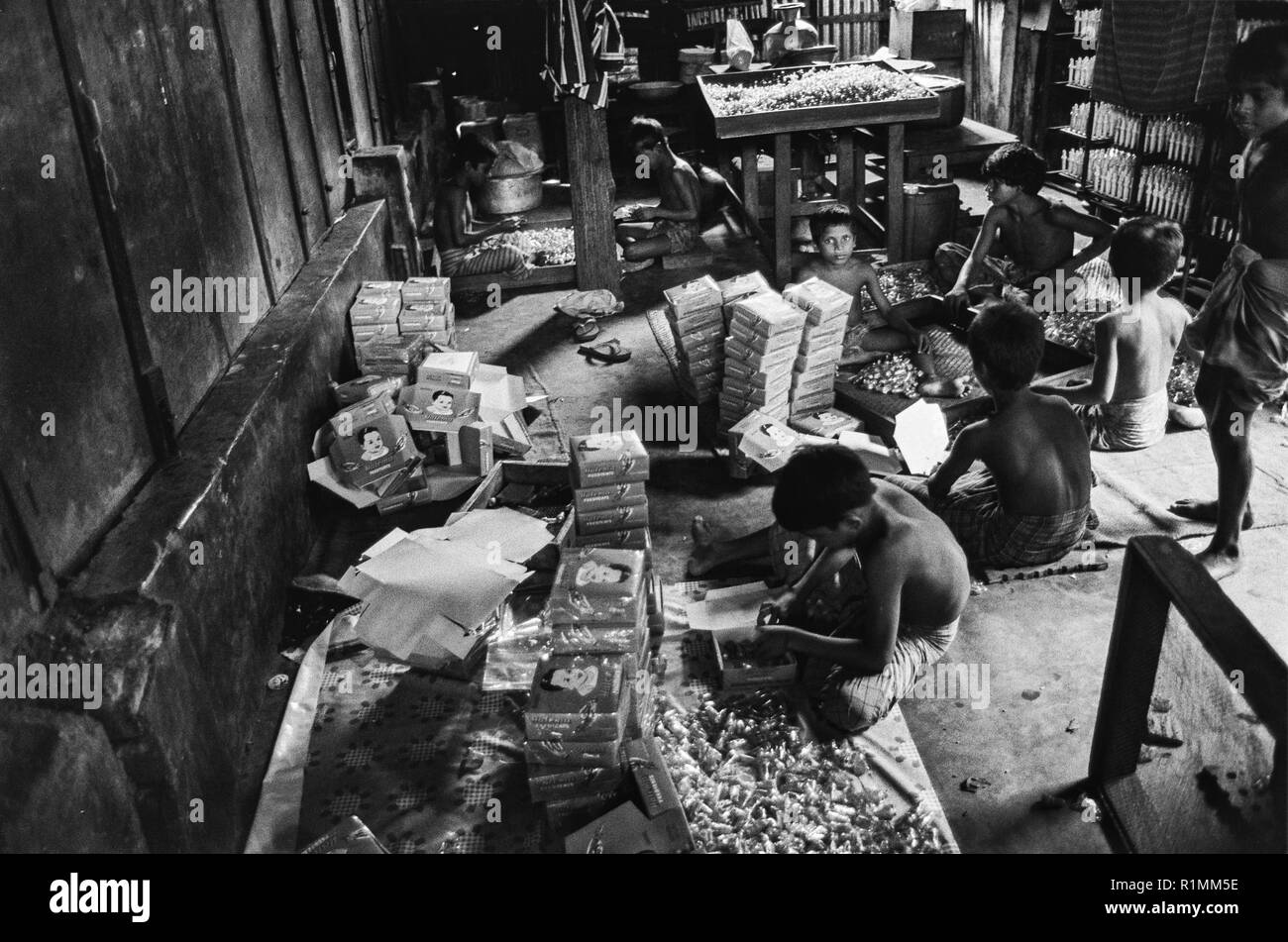 80/24 Child workers in factory making teats for baby bottles, Old Dhaka ...