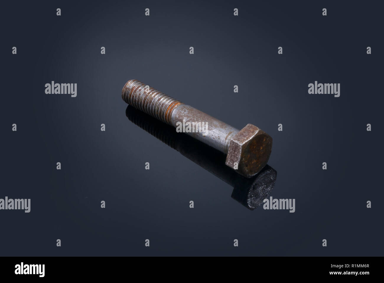 Metal rusty bolt and close-up with reflection on black background Stock ...