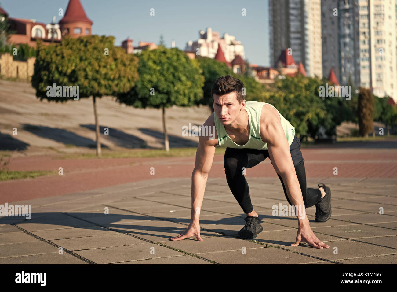 Ready steady go. Healthy lifestyle concept. Man runner at starting ...
