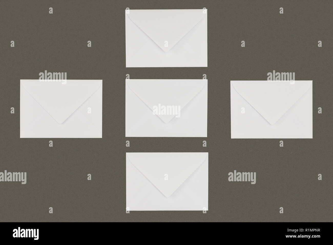 top view of white envelopes arranged isolated on grey background Stock ...