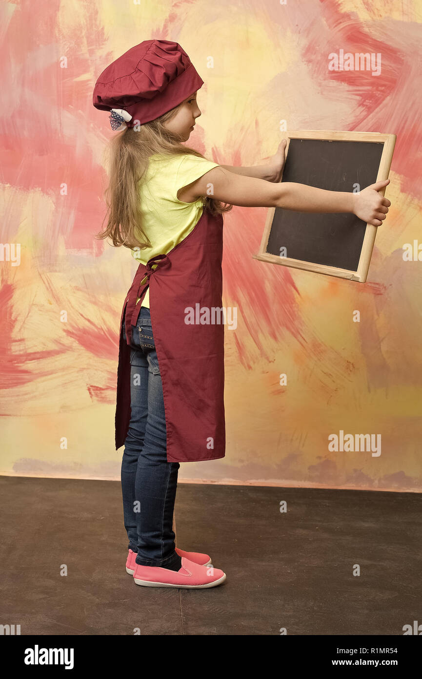 little chef holding blank cook restaurant menu board on colorful ...