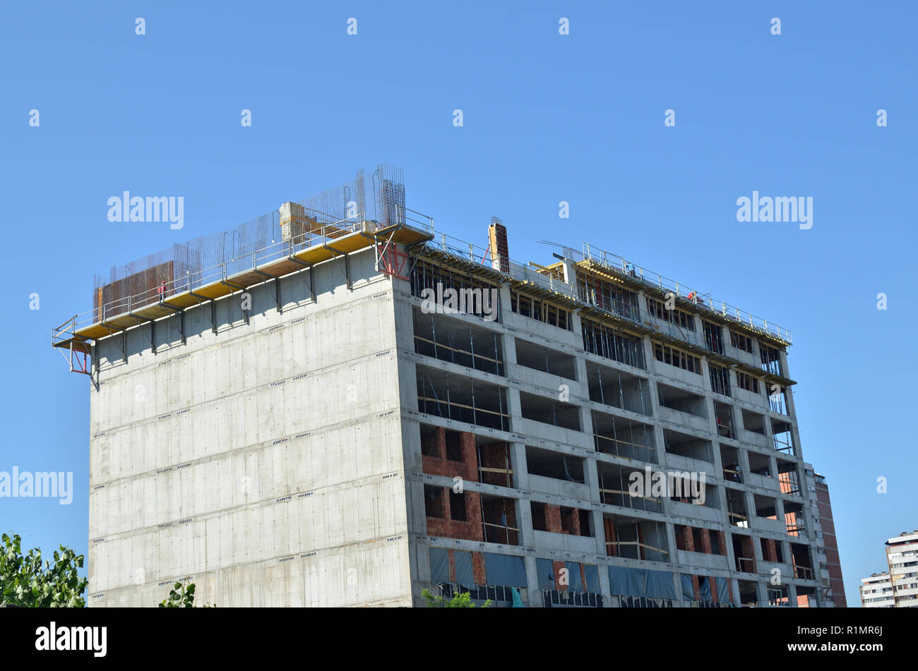 Building during construction works in a city area Stock Photo - Alamy