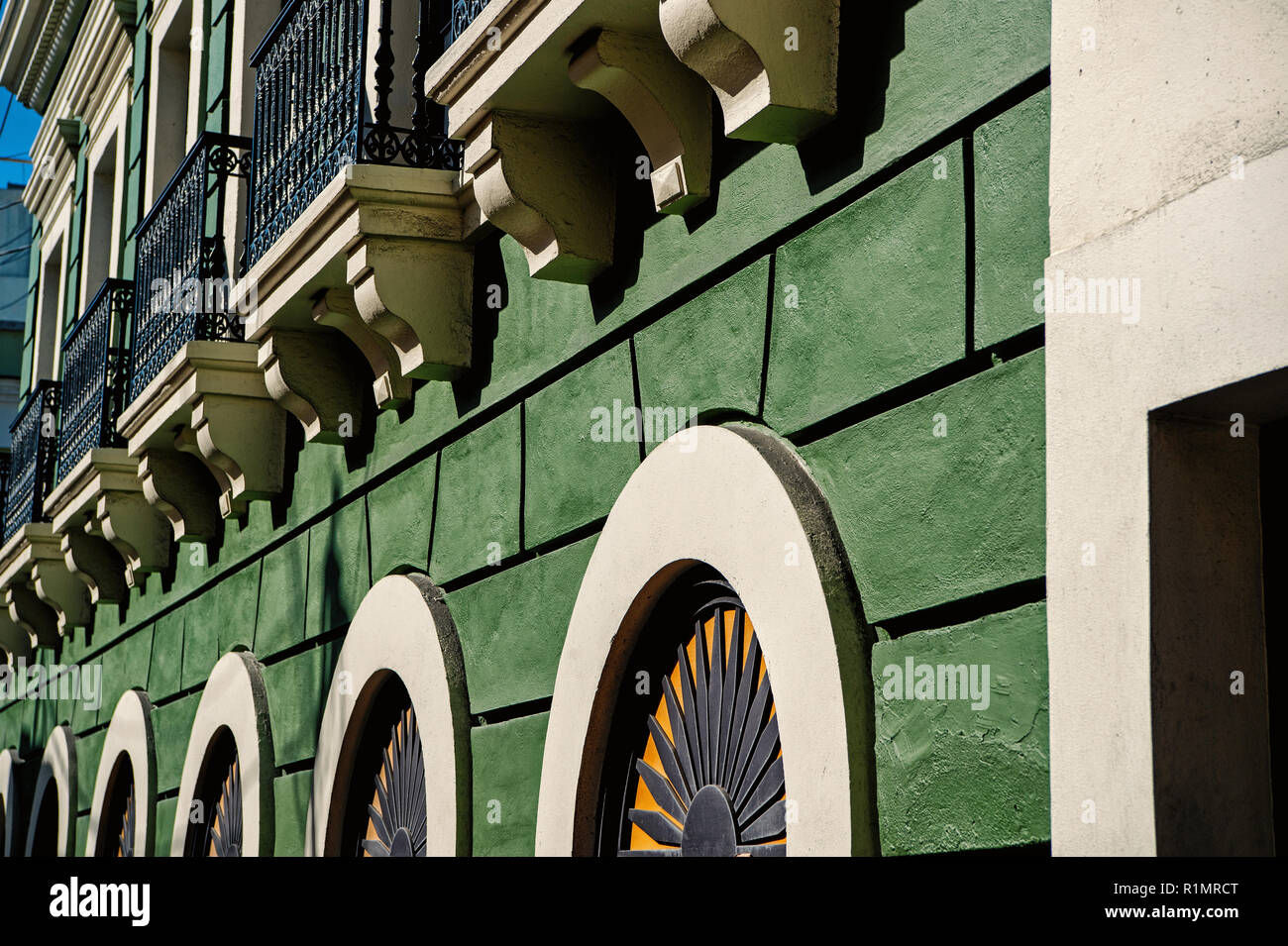 Facade wall on green plastered background in San Juan, Puerto Rico ...