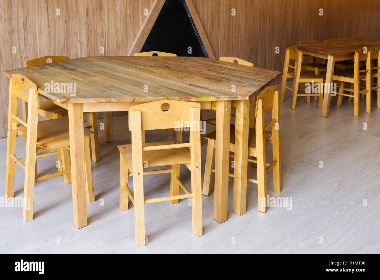 wooden tables and small chairs in kindergarten room Stock Photo - Alamy