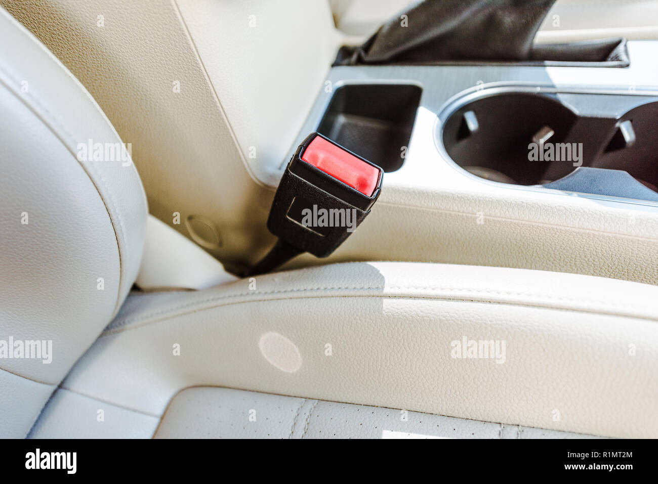 cropped image of leather car seats and retractable platform of seatbelt ...