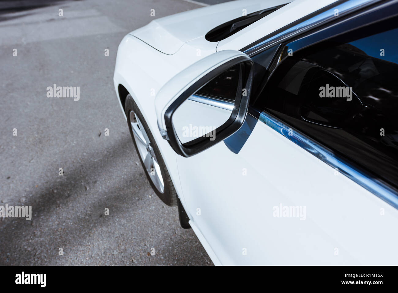 side mirror and wheel of new white car on street Stock Photo - Alamy