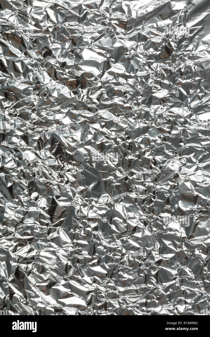 Aluminum foil roll for background, close up Stock Photo - Alamy