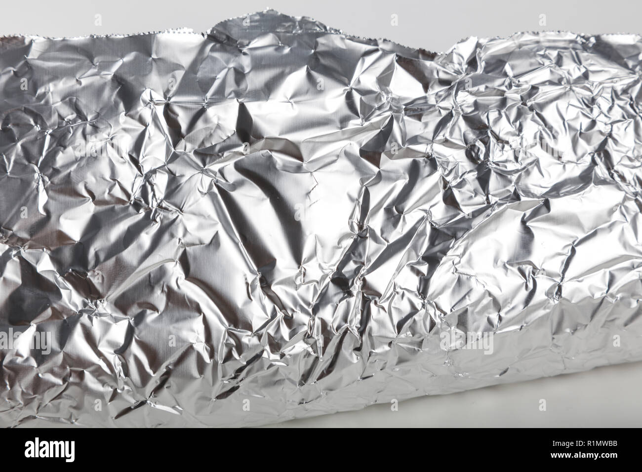 Aluminum foil roll for background, close up Stock Photo - Alamy
