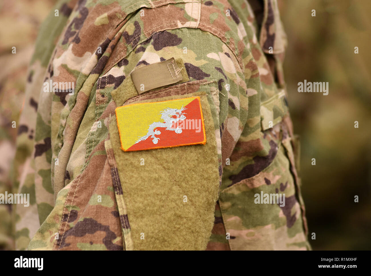 Bhutan flag on soldiers arm. (collage Stock Photo - Alamy