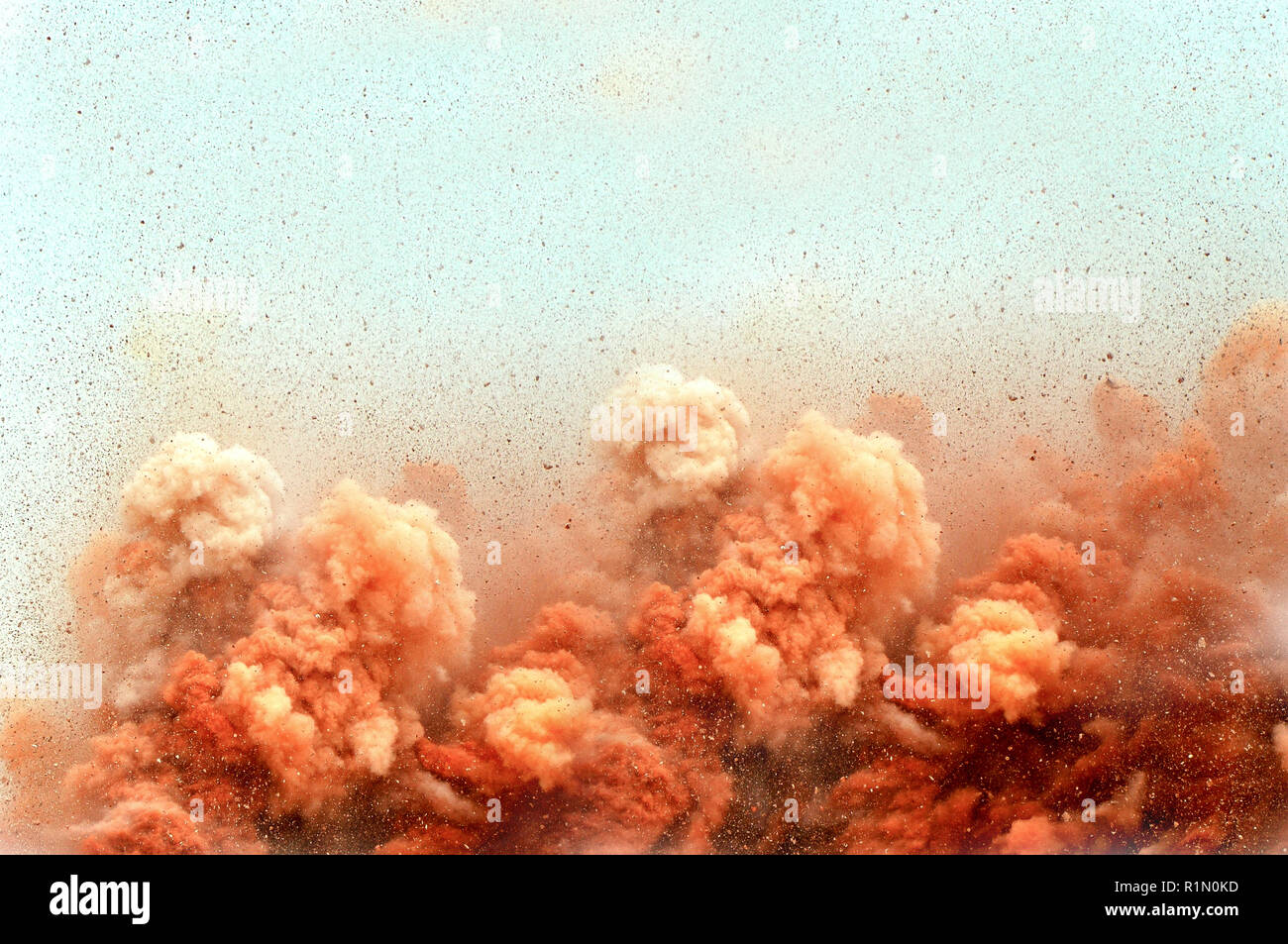 Flying rocks and dust clouds after the blast in on the construction ...