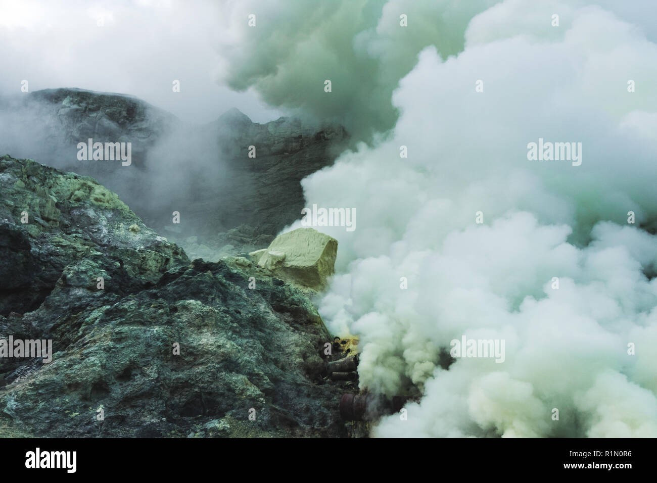 Dangerous trip Inside Ijen volcano crater Stock Photo - Alamy