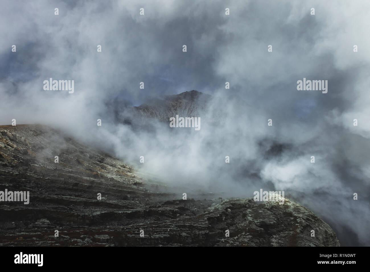 Dangerous trip Inside Ijen volcano crater Stock Photo - Alamy