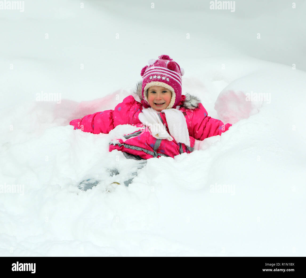 happy little girl in snow Stock Photo - Alamy