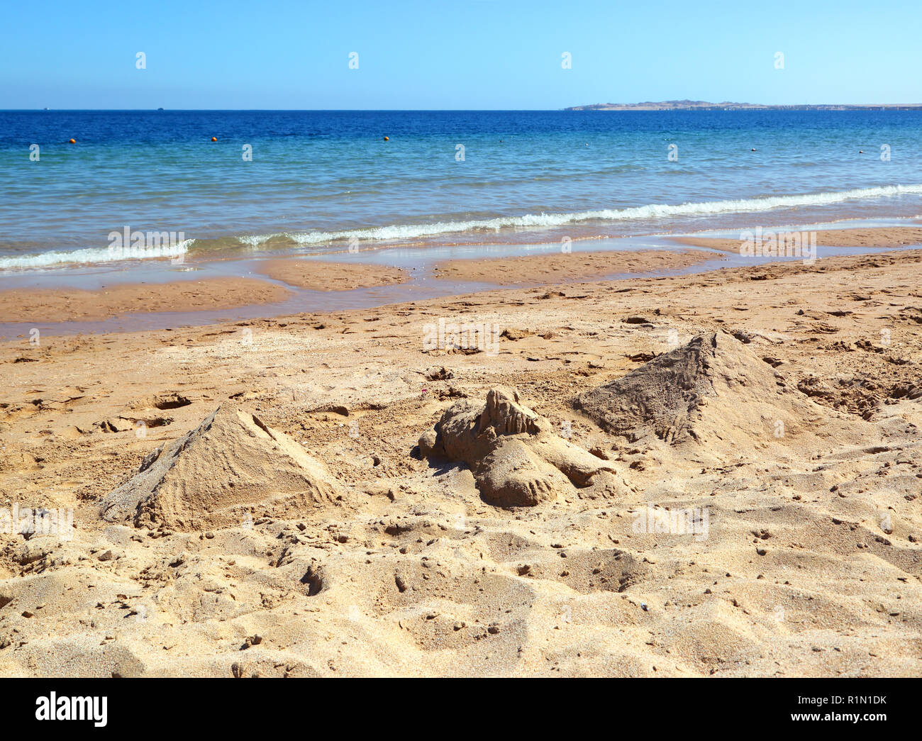 Egypt pyramids and sphinx from sand on beach Stock Photo - Alamy