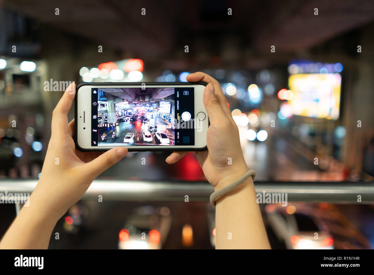 Taking night scene photo with phone Stock Photo - Alamy