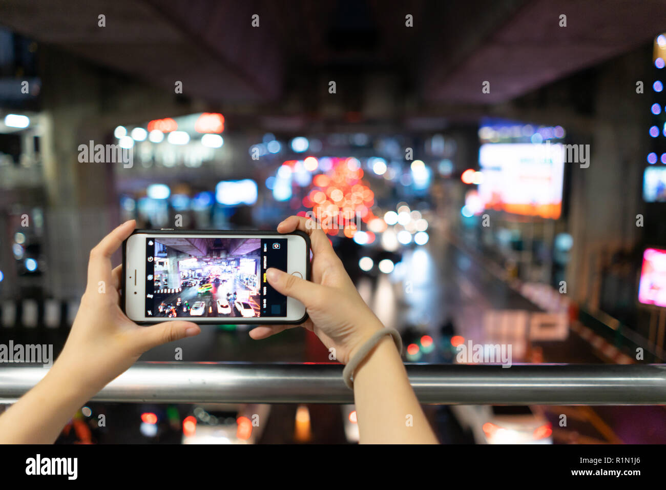 Taking night scene photo with phone Stock Photo - Alamy