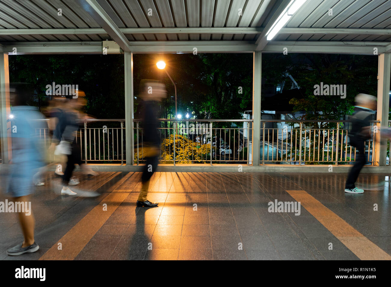 Group of people walking across bridge hi-res stock photography and ...