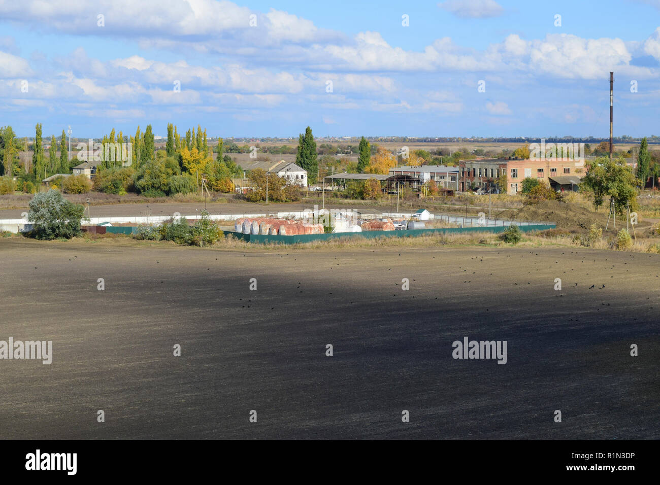 A view from above of a small Russian village. Rural landscape. Field ...