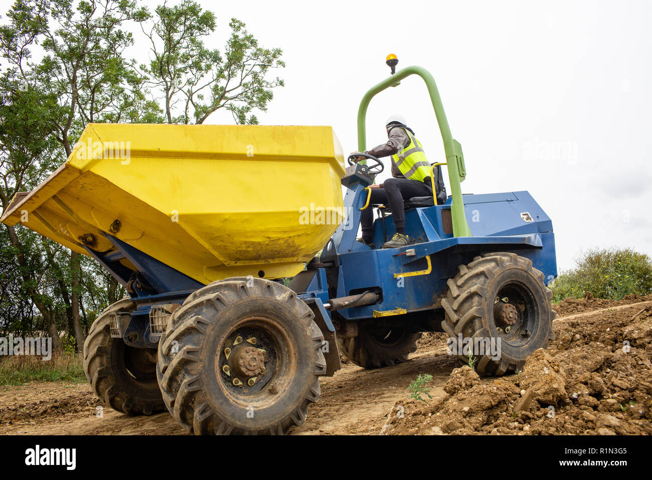 Front tipper in construction site Stock Photo - Alamy