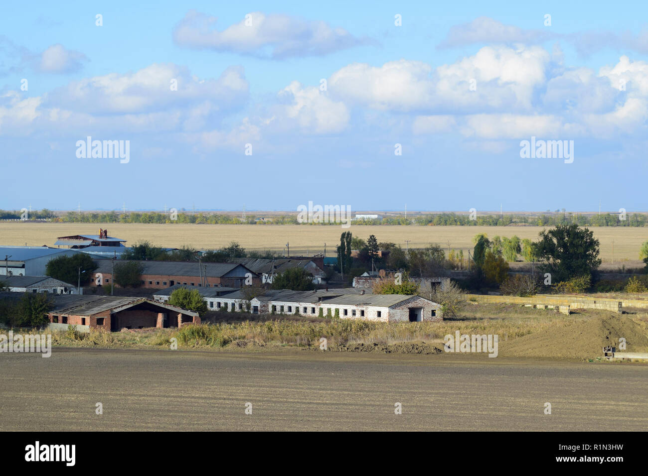 A view from above of a small Russian village. Rural landscape. Field ...