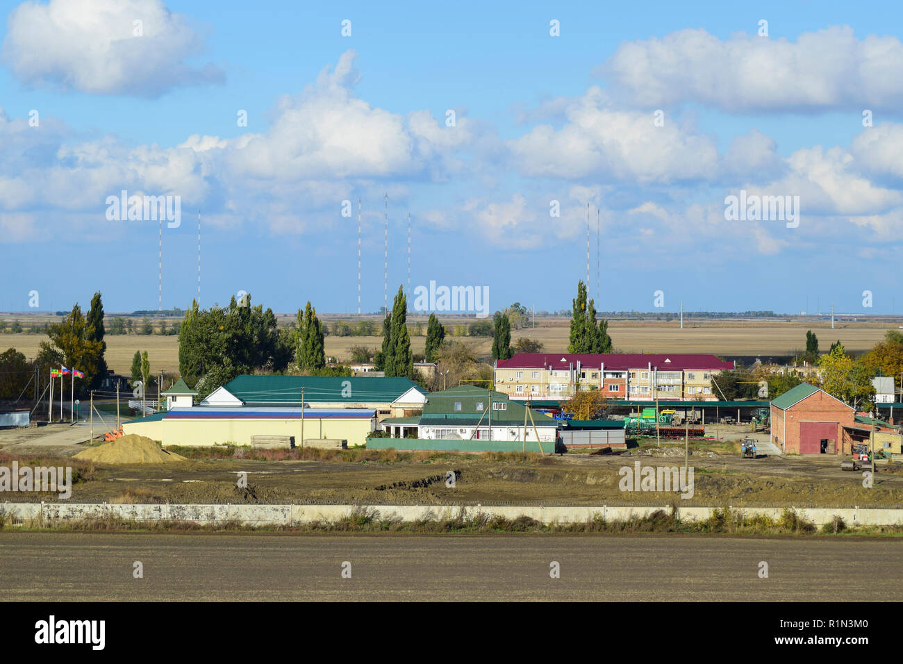 A view from above of a small Russian village. Rural landscape. Field ...