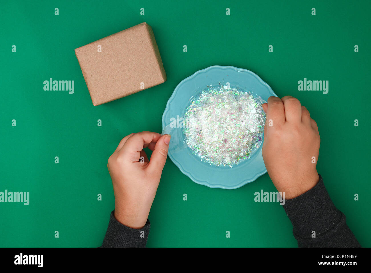 The original design of a Christmas gift from craft paper, scotch tape ...