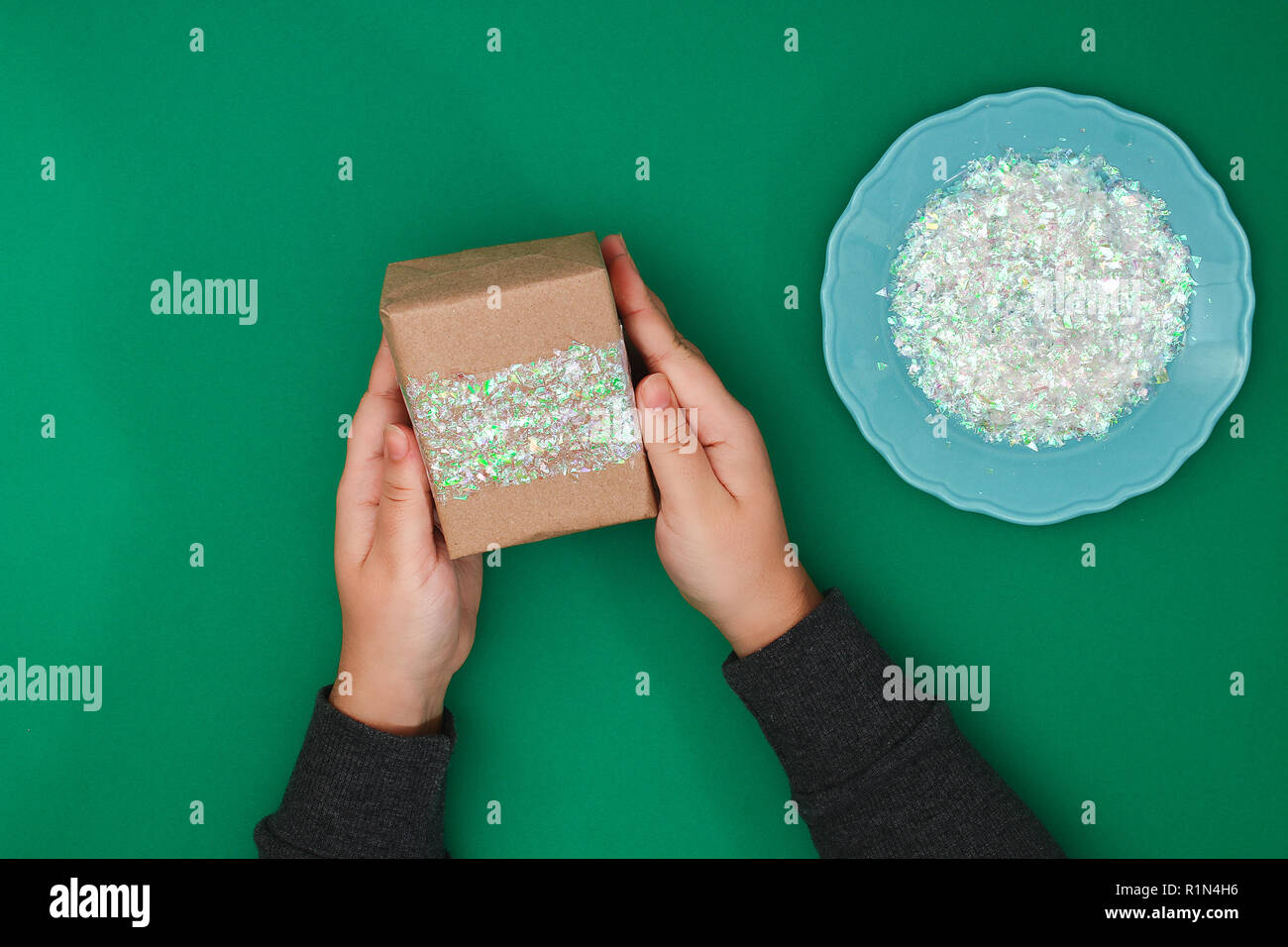 The original design of a Christmas gift from craft paper, scotch tape ...