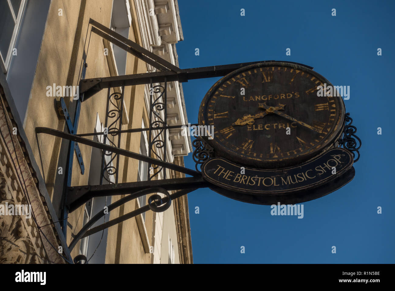 Old clock on wall of building. Bristol Stock Photo - Alamy