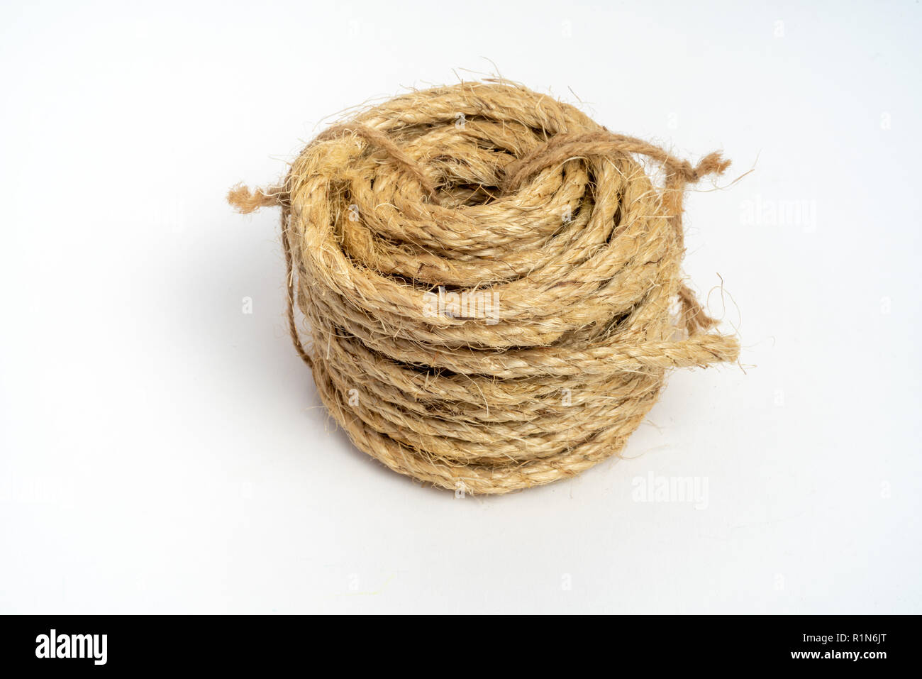 Coil of fiber rope sisal small on isolated white background Stock Photo ...