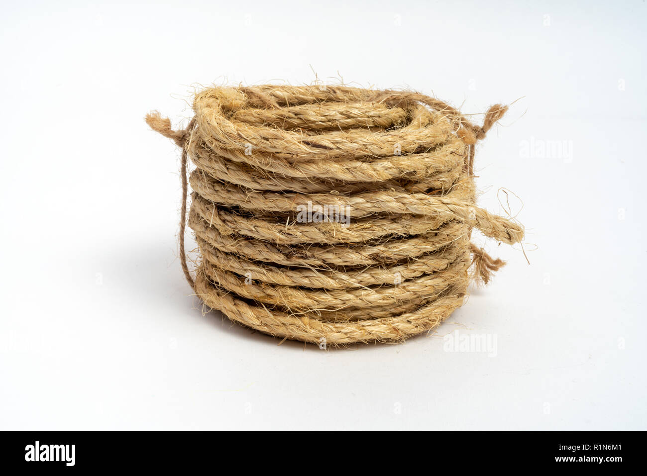 Coil of fiber rope sisal small on isolated white background Stock Photo ...